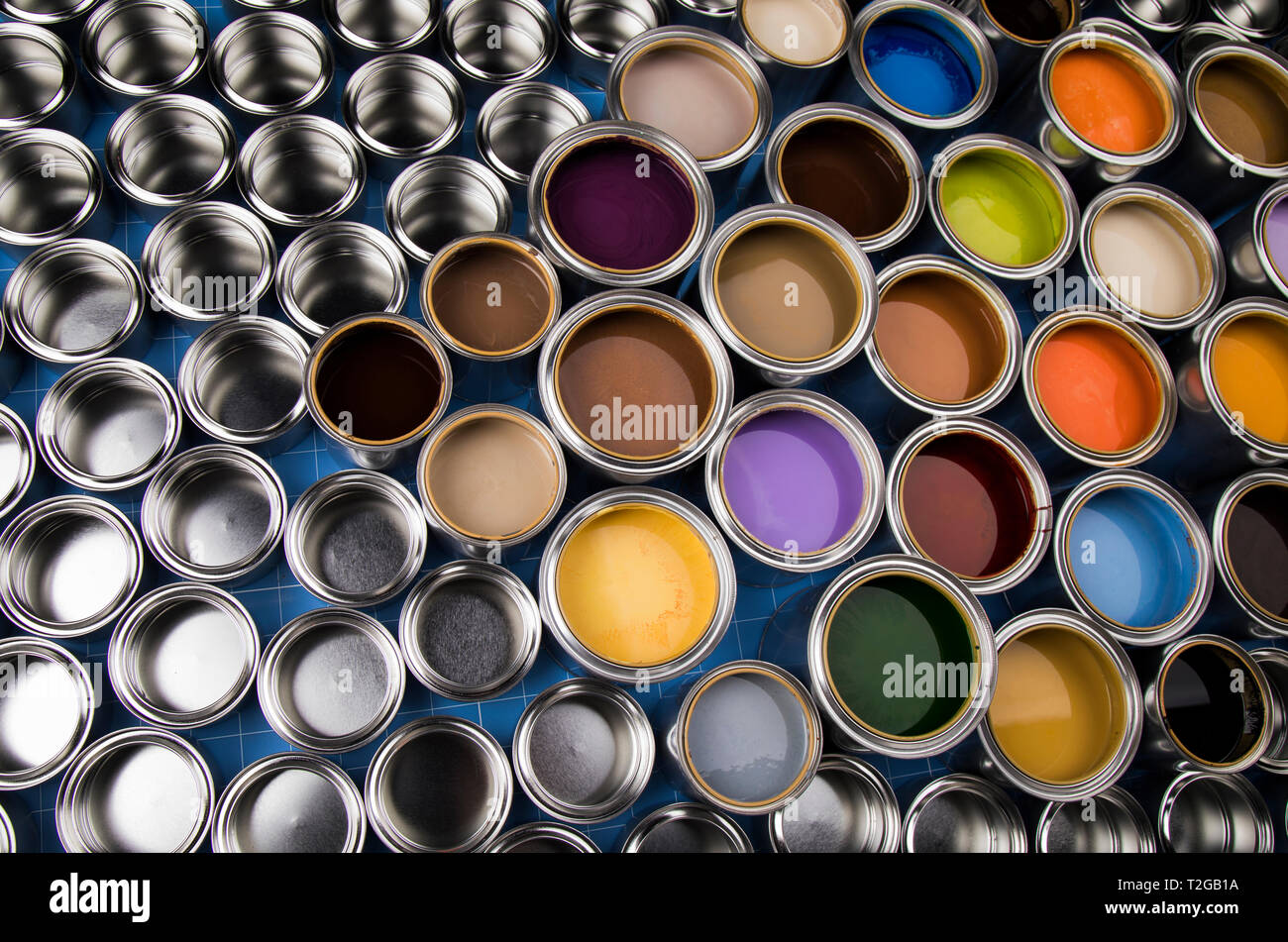 Concept group of tin metal cans with color paint Stock Photo - Alamy