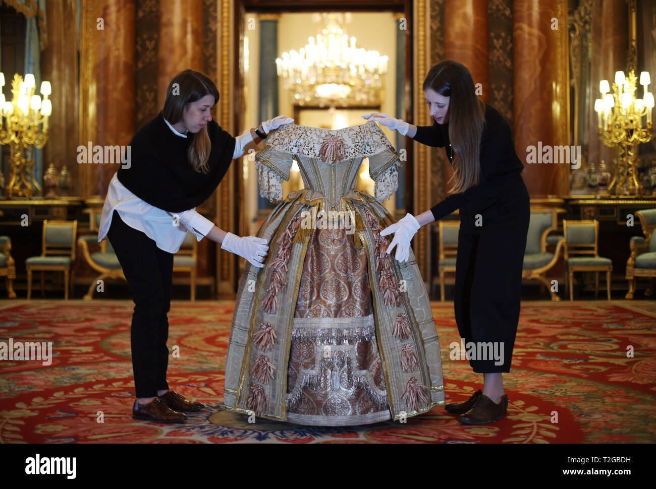 Buckingham palace staff arranging queen victorias stuart ball costume ...