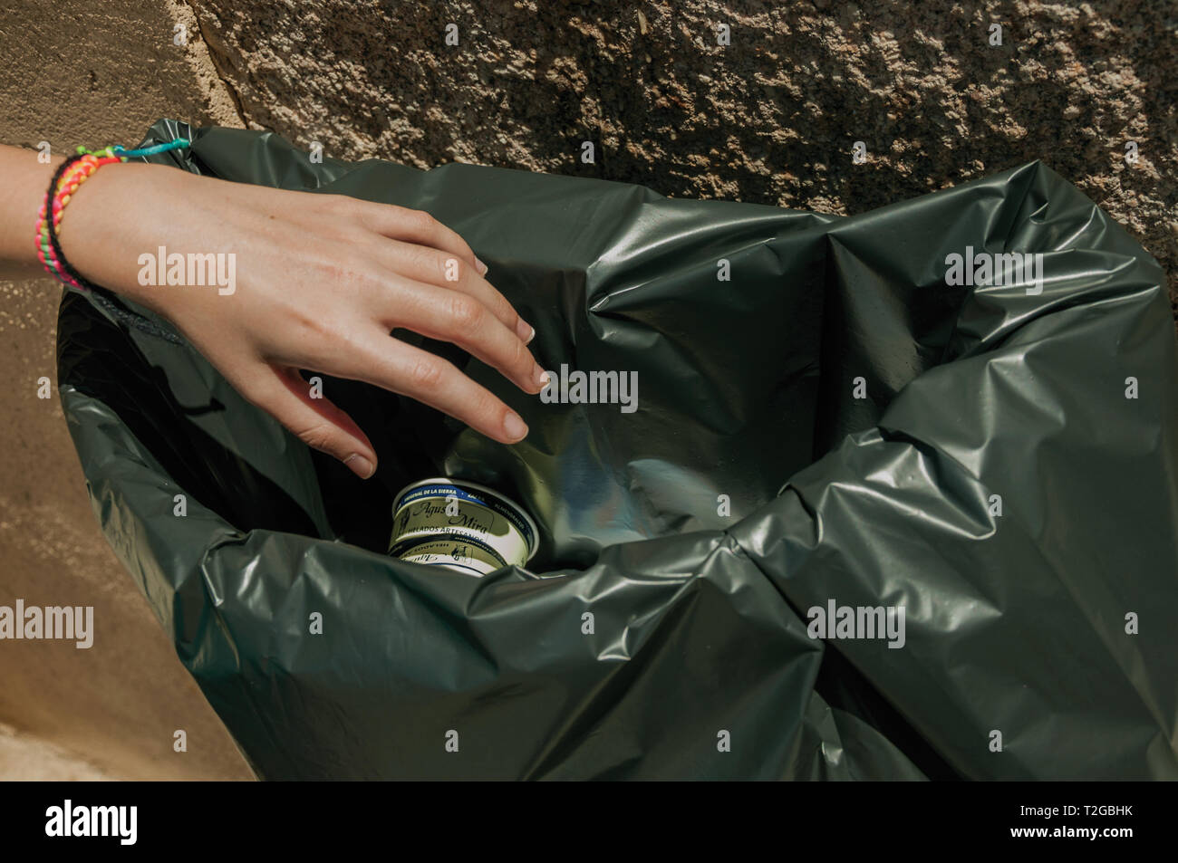 Girl throwing rubbish bag in hi-res stock photography and images - Alamy