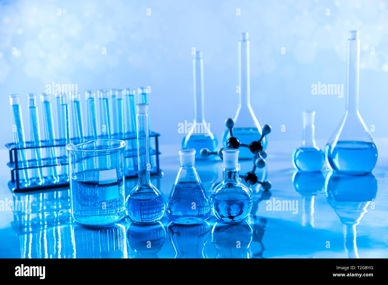 Laboratory beakers,Science experiment, blue background Stock Photo - Alamy