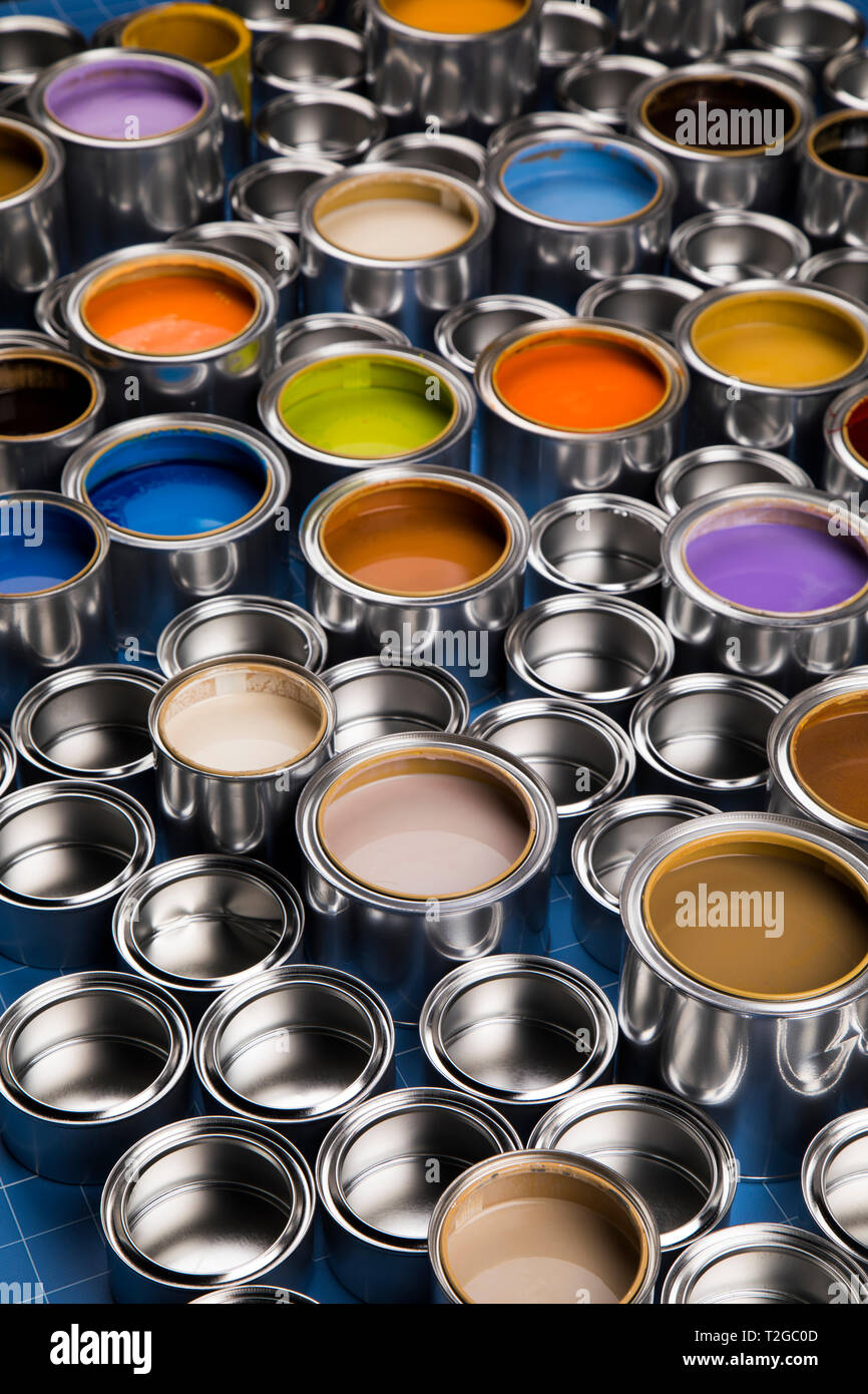 Concept group of tin metal cans with color paint Stock Photo - Alamy