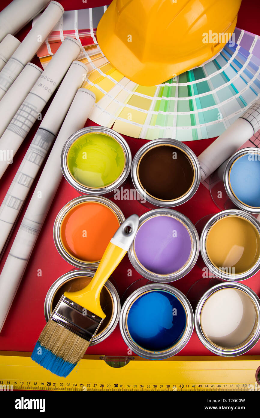 Open buckets with a paint and brush, red background Stock Photo - Alamy