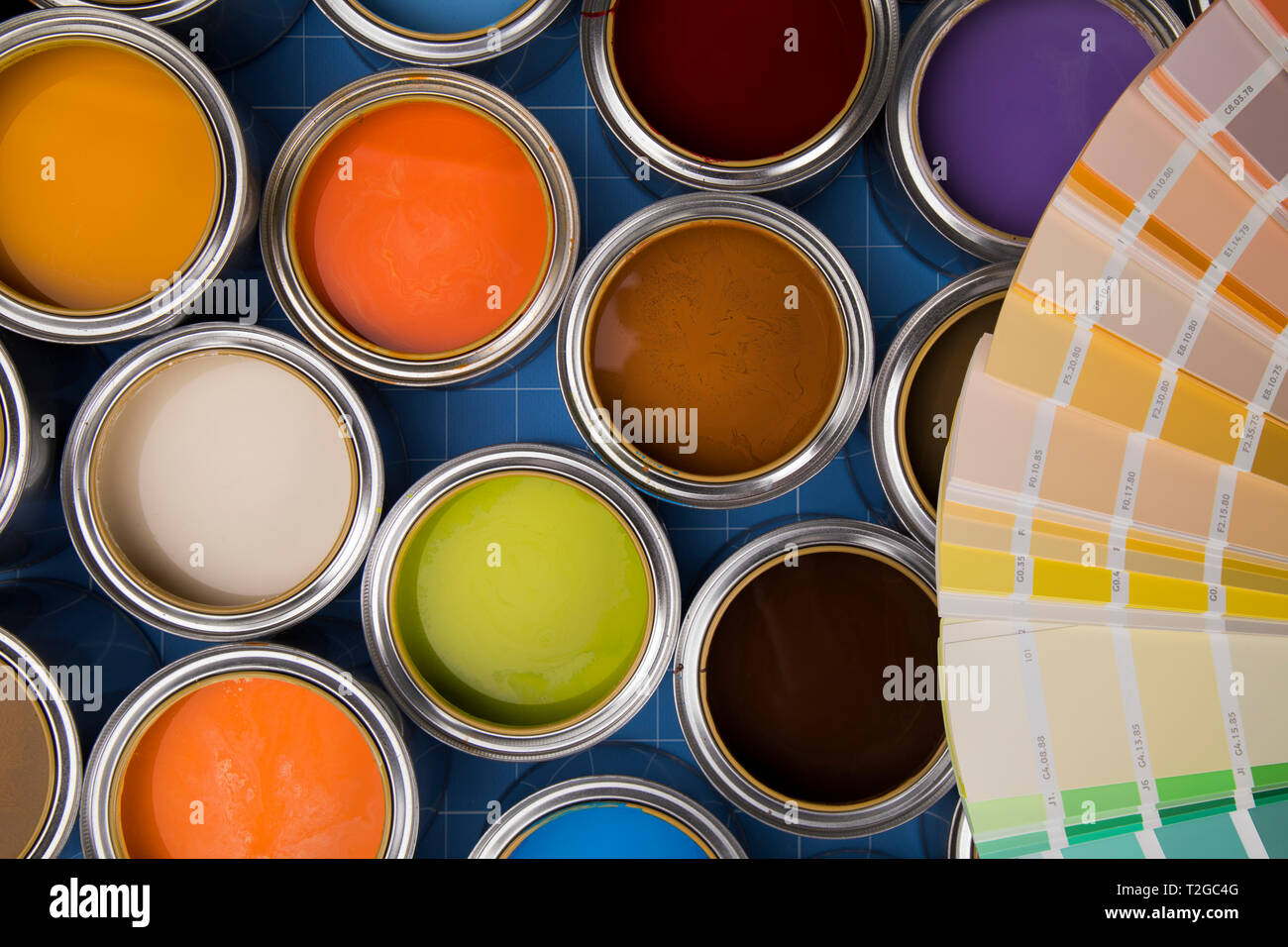 Buckets full of rainbow colored oil paint Stock Photo - Alamy