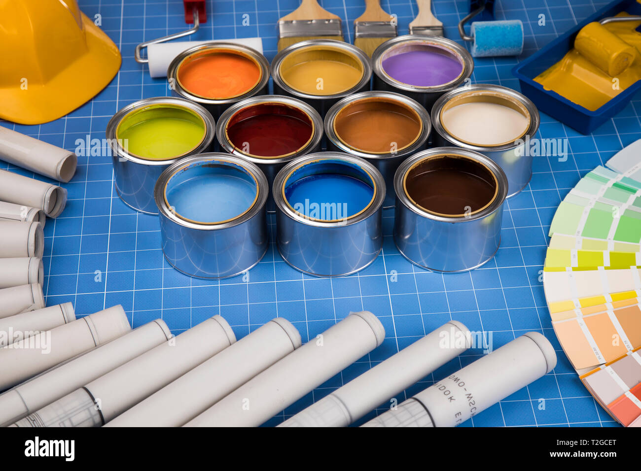 Paint brush, tin can and color guide samples, blue background Stock ...