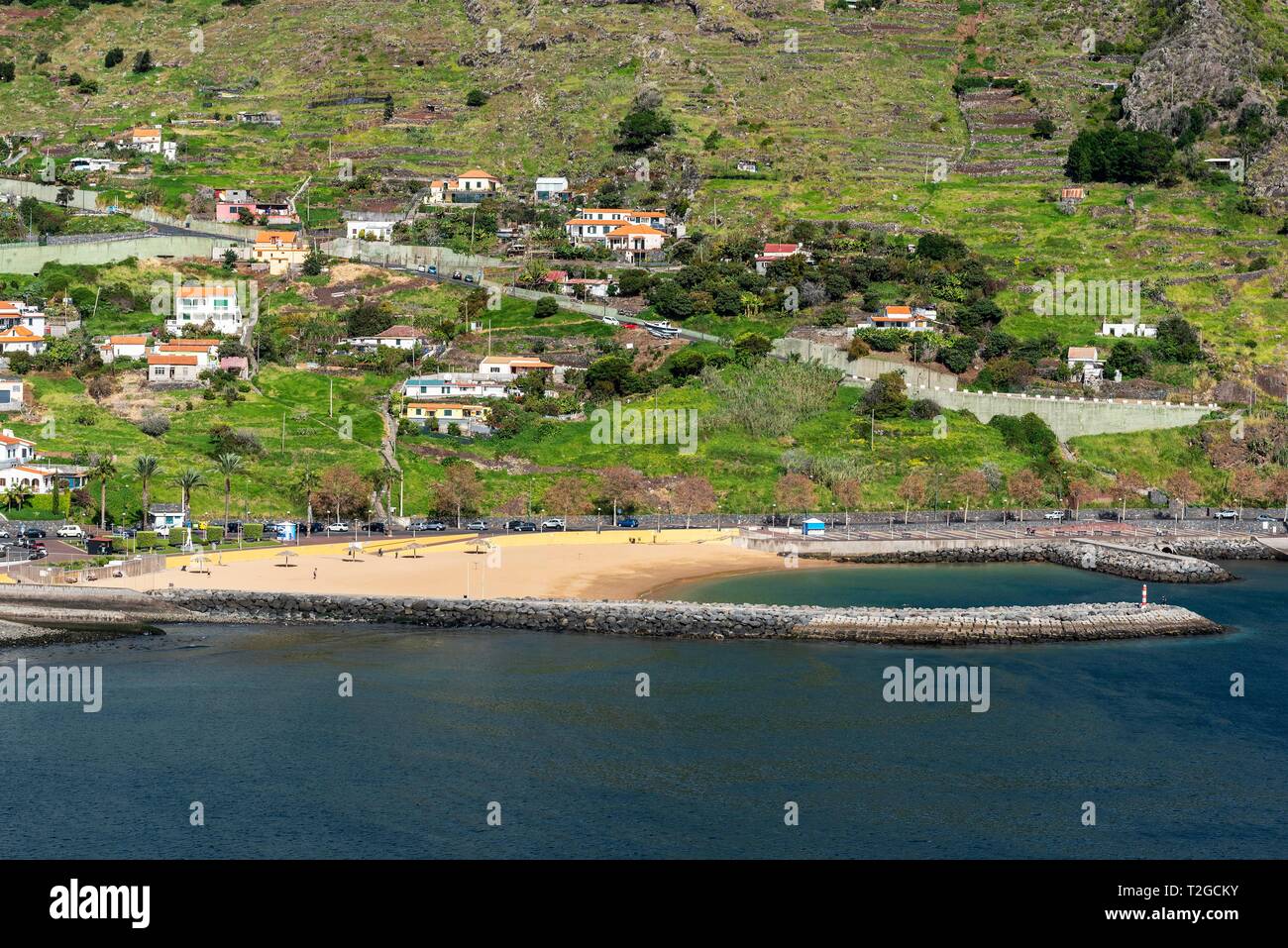 Sandy beach in the coastal town of Machico on the east coast, Madeira ...