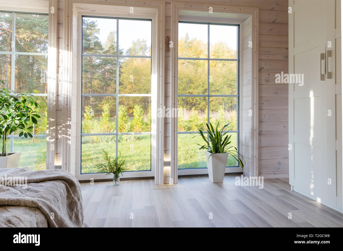 Bright interior, room in wooden house with large window. Scandinavian ...