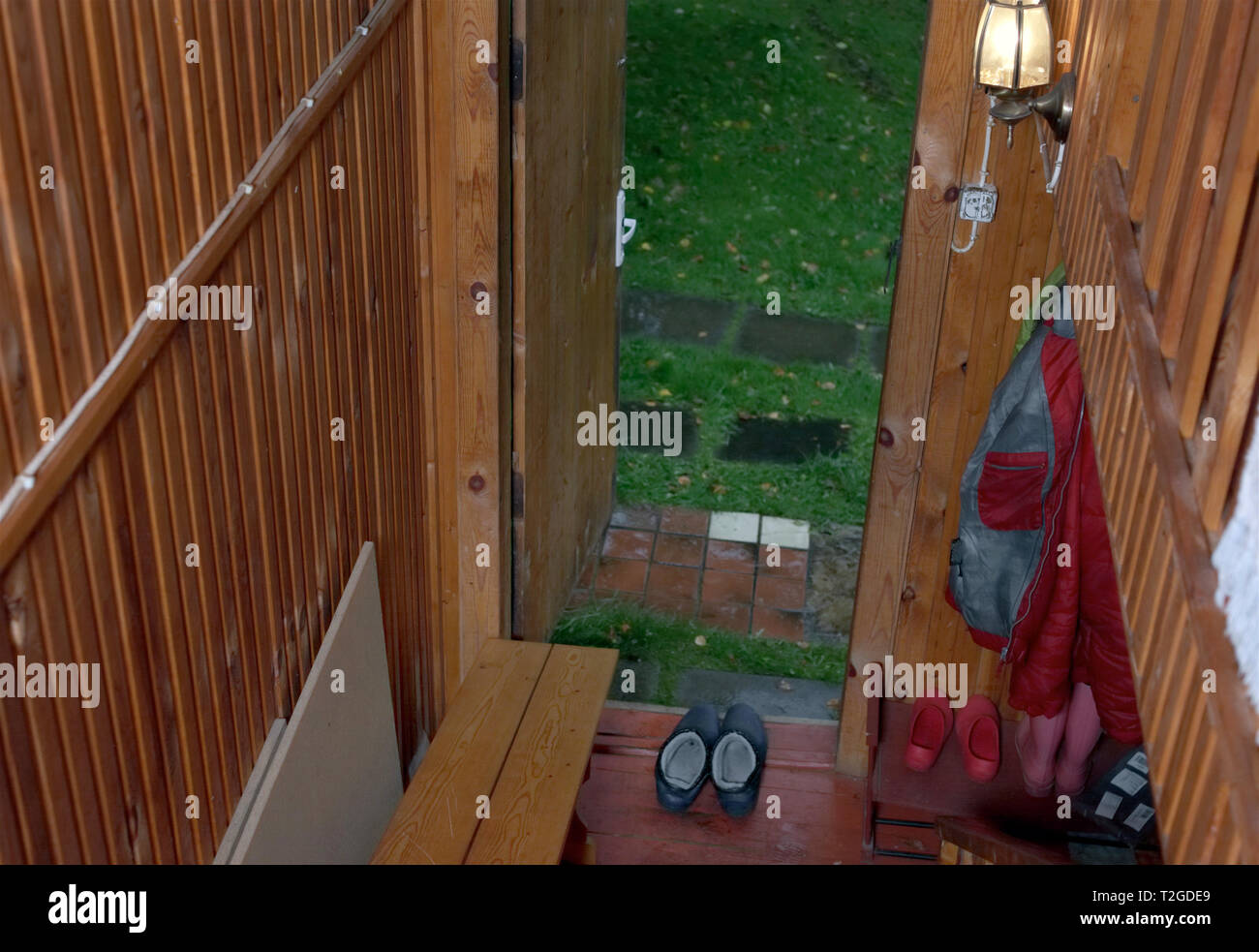 wooden house interior with boots left in a doorway Stock Photo - Alamy