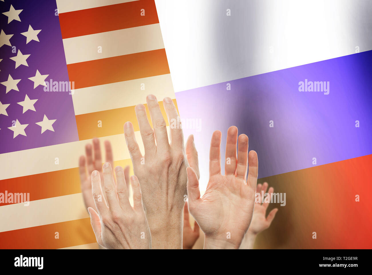 People raising hands on flag Russia and USA background Stock Photo - Alamy