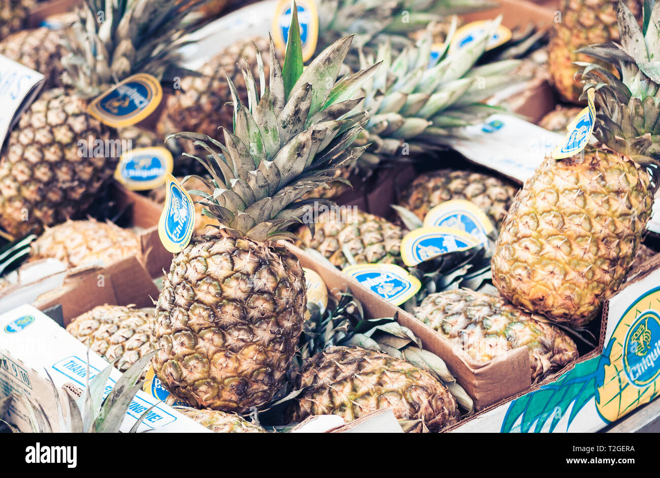 Fruit shop with fresh grapes and pineapples in Paris Stock Photo - Alamy