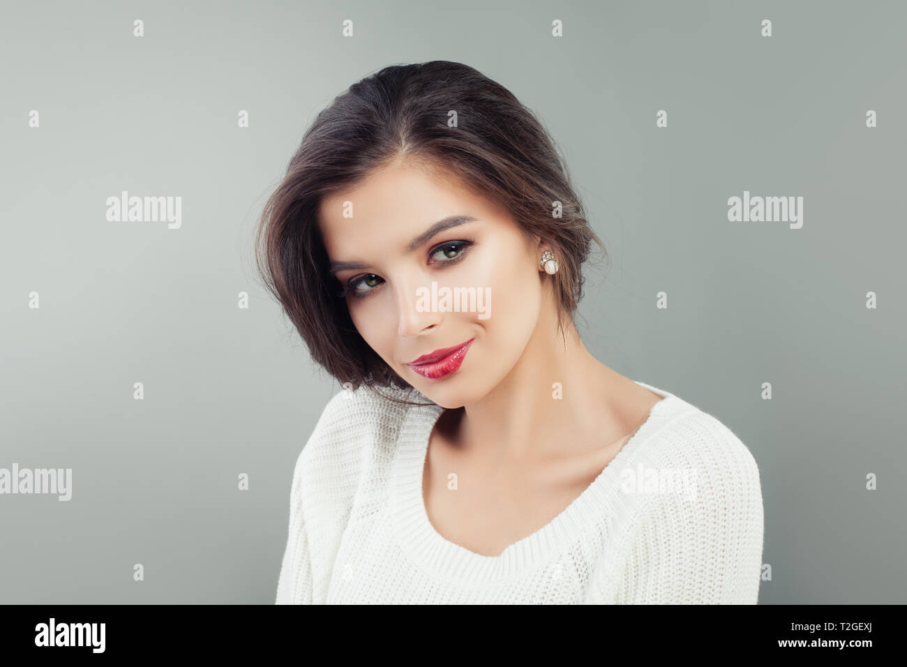 Beautiful woman looking aside. Indoor portrait of perfect female model ...
