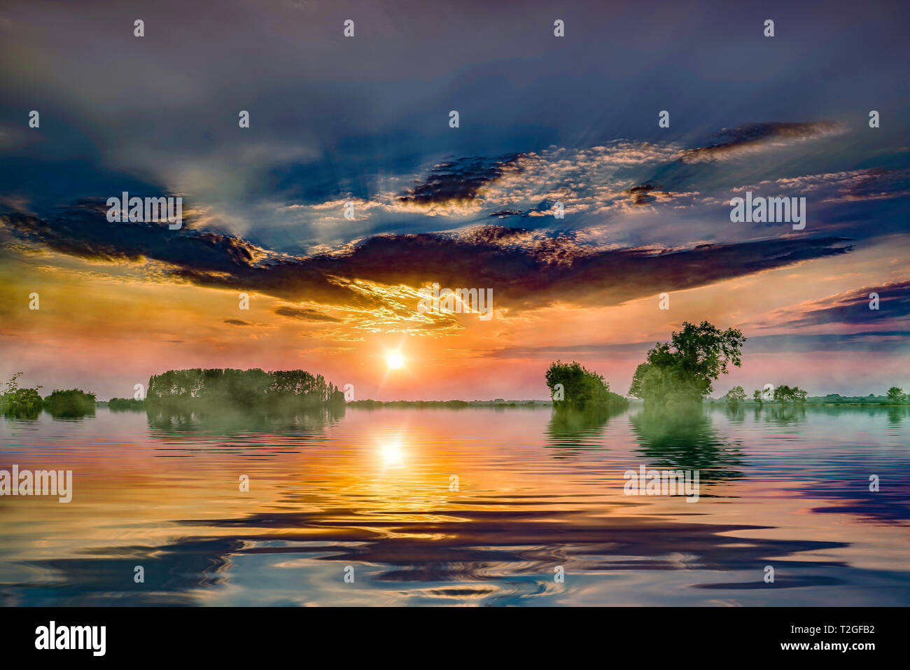 Sunset over Water Stock Photo - Alamy
