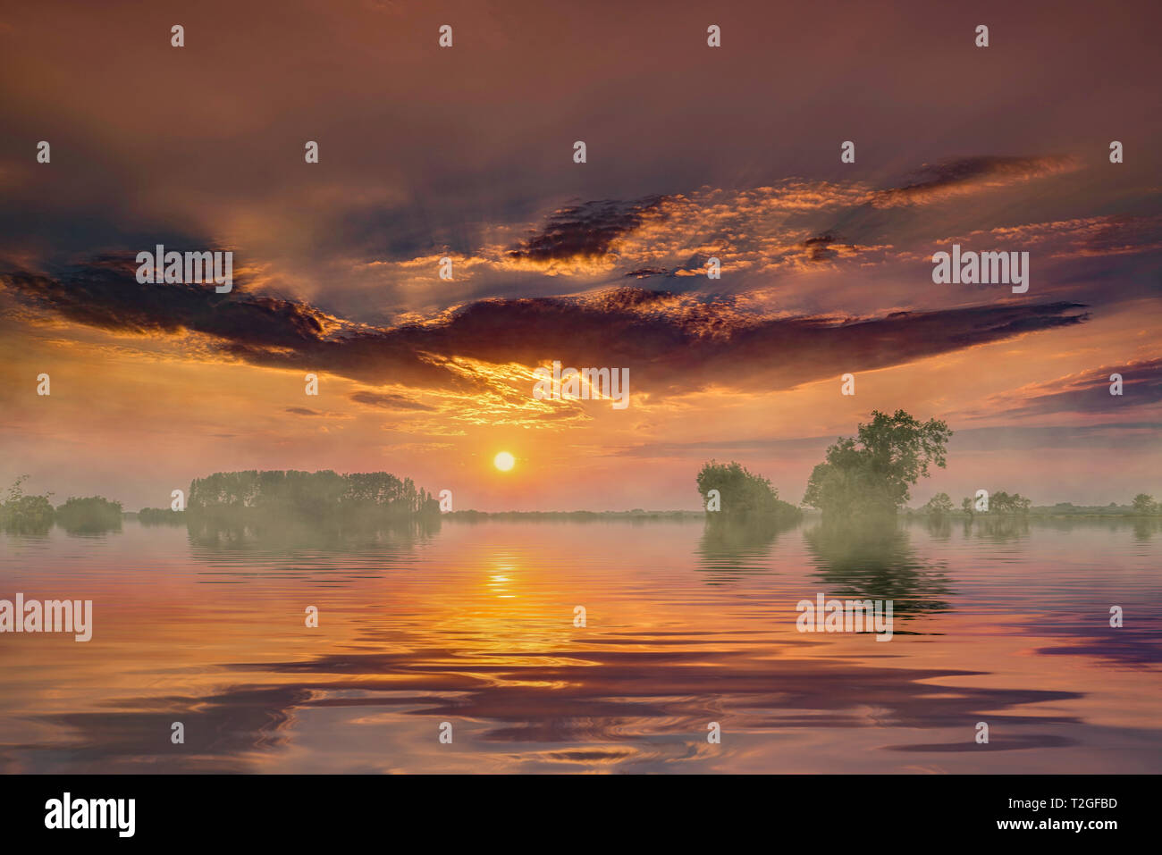 Sunset over Water Stock Photo - Alamy