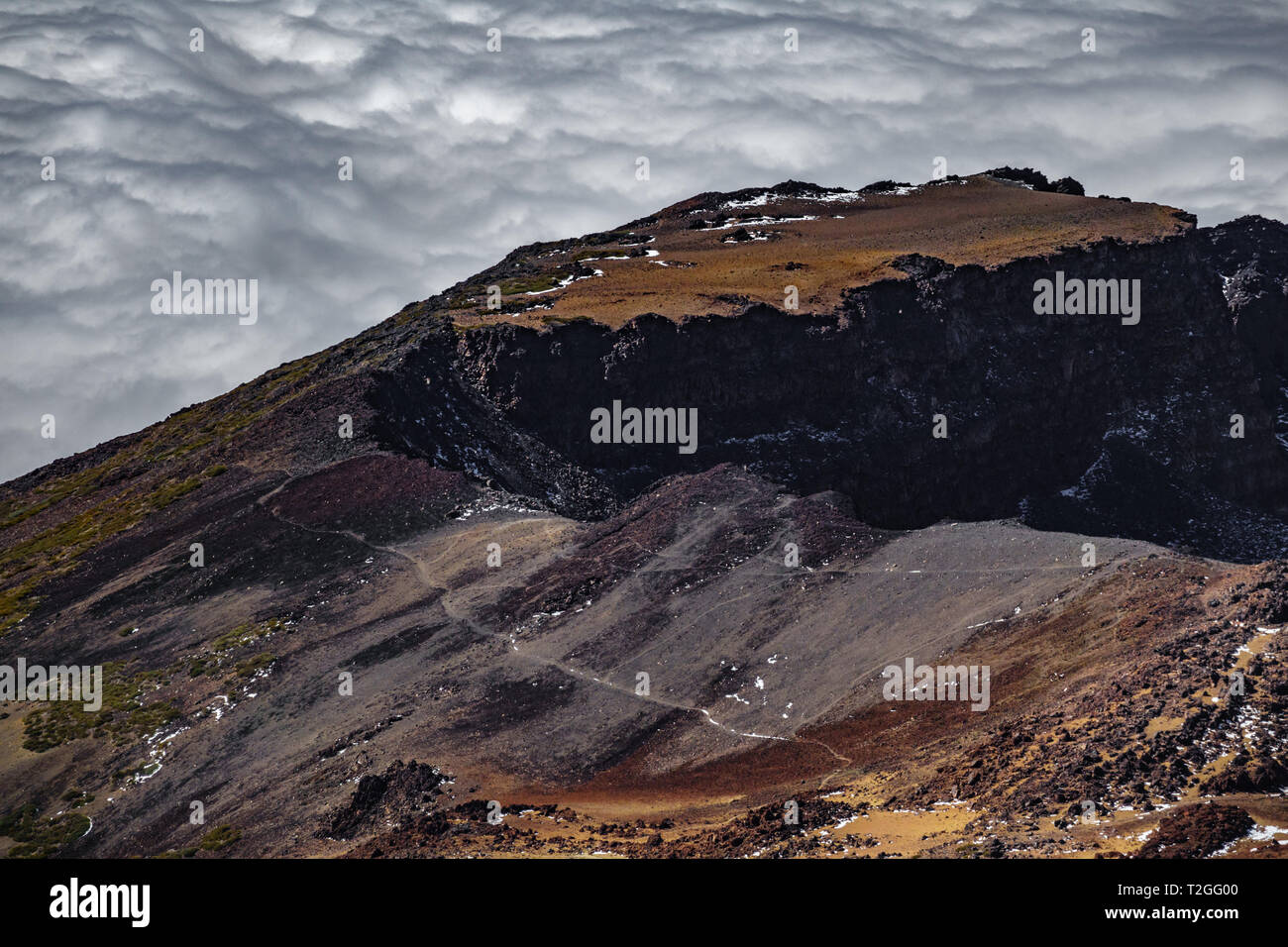 Top aerial view of volcanic crater over the clouds Stock Photo - Alamy