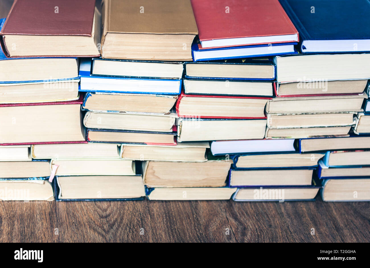 Stack of books education background, many books piles with copy space ...