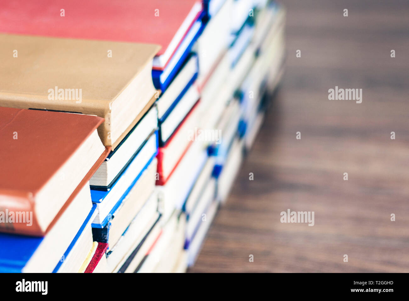 Stack of books education background, many books piles with copy space ...