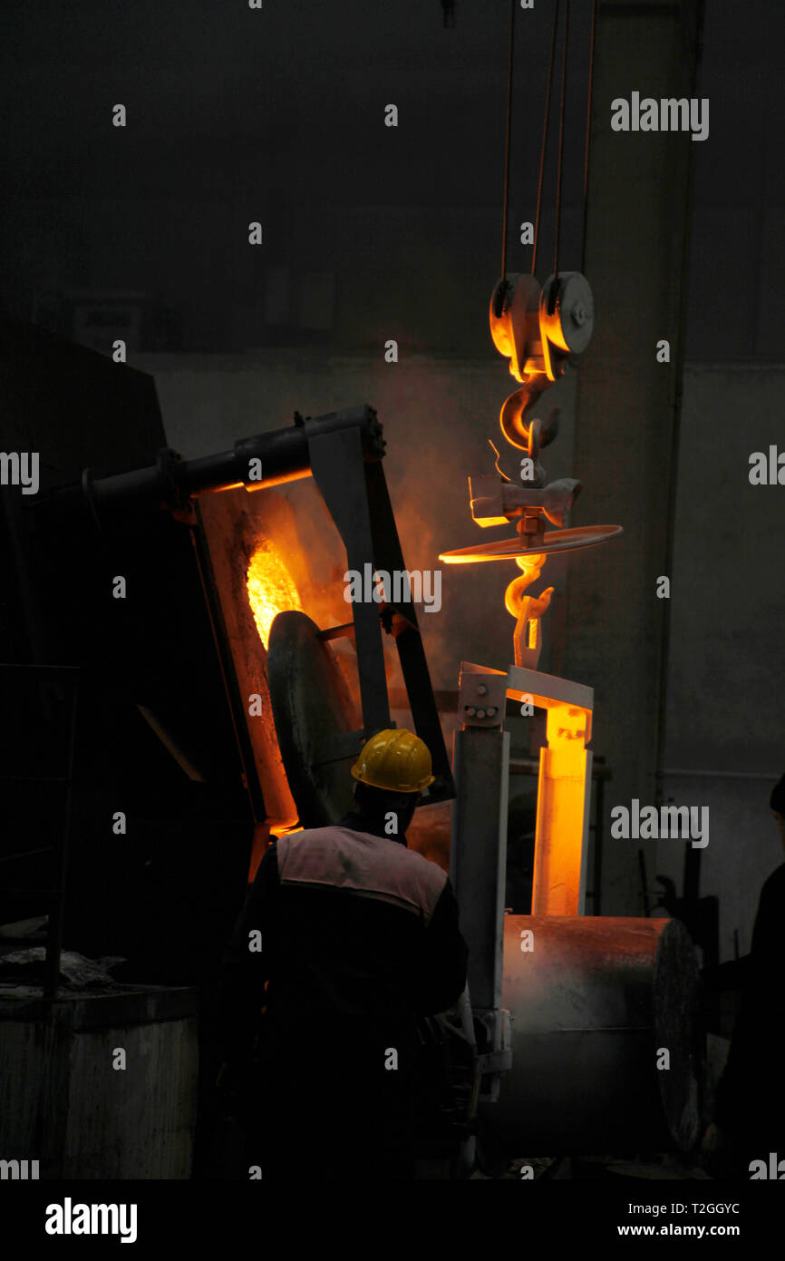 casting factory and worker Stock Photo - Alamy