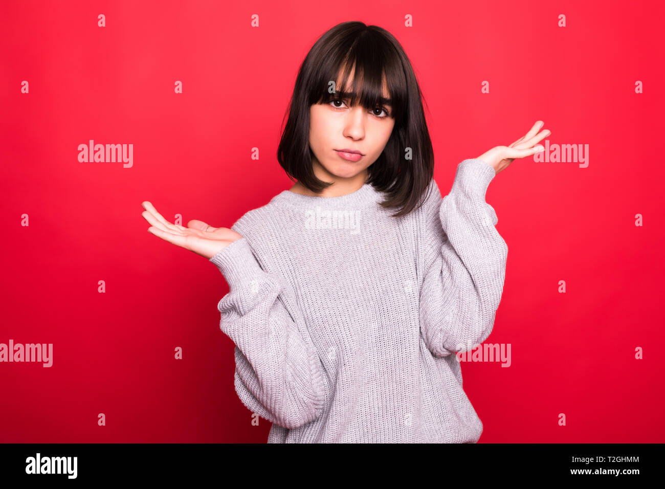 Woman shrugging shoulders hi-res stock photography and images - Alamy