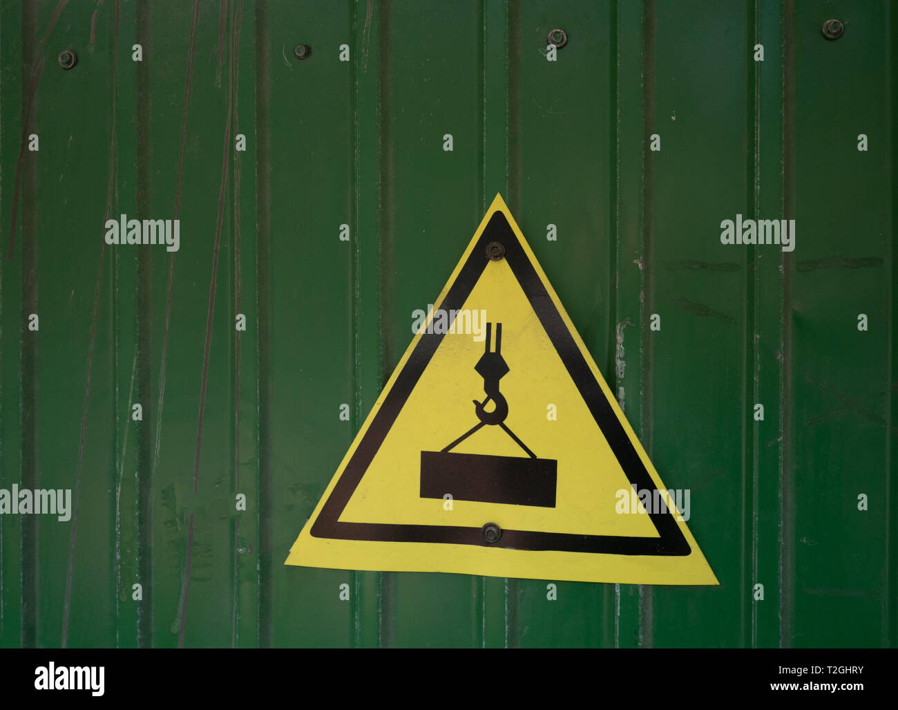 green fence wall near developing building construction site with ...