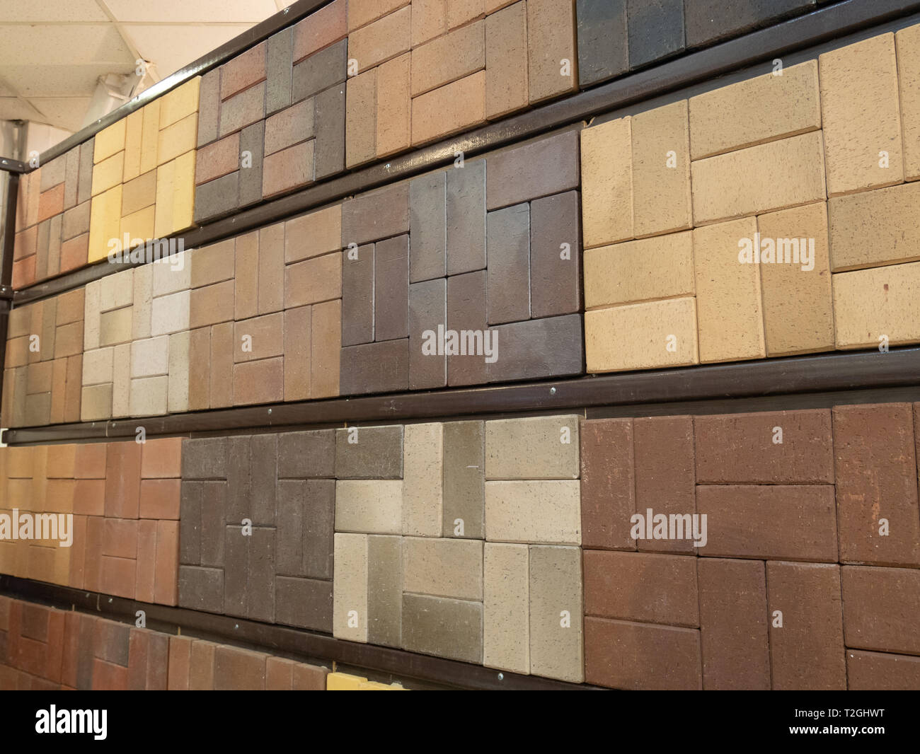 wall made of different samples of sidewalk pavement bricks tiles ...