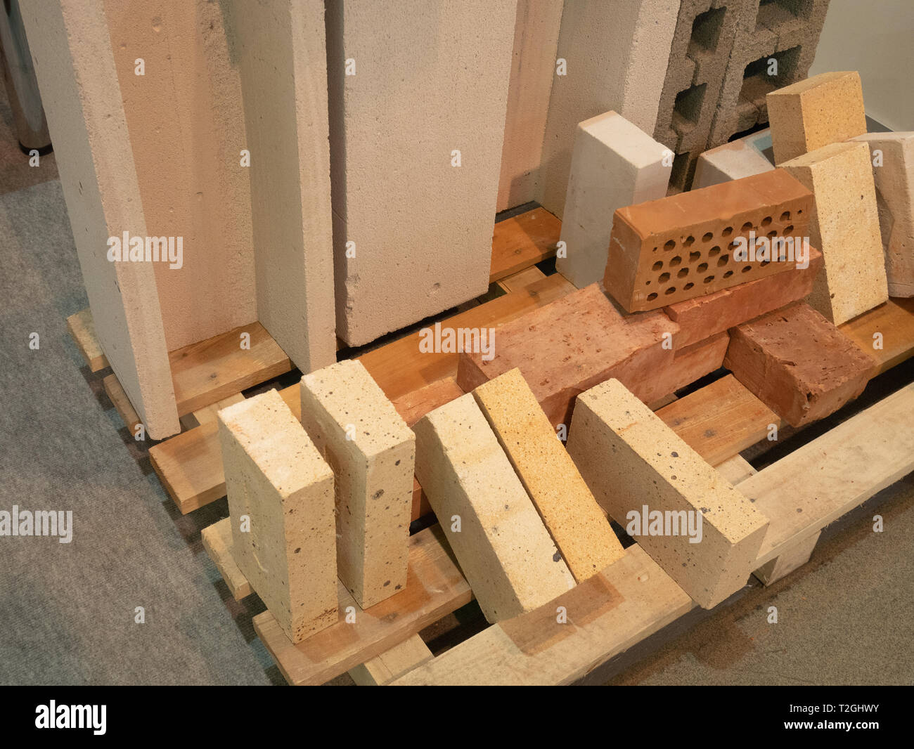 group of different samples of building bricks and concrete blocks on ...