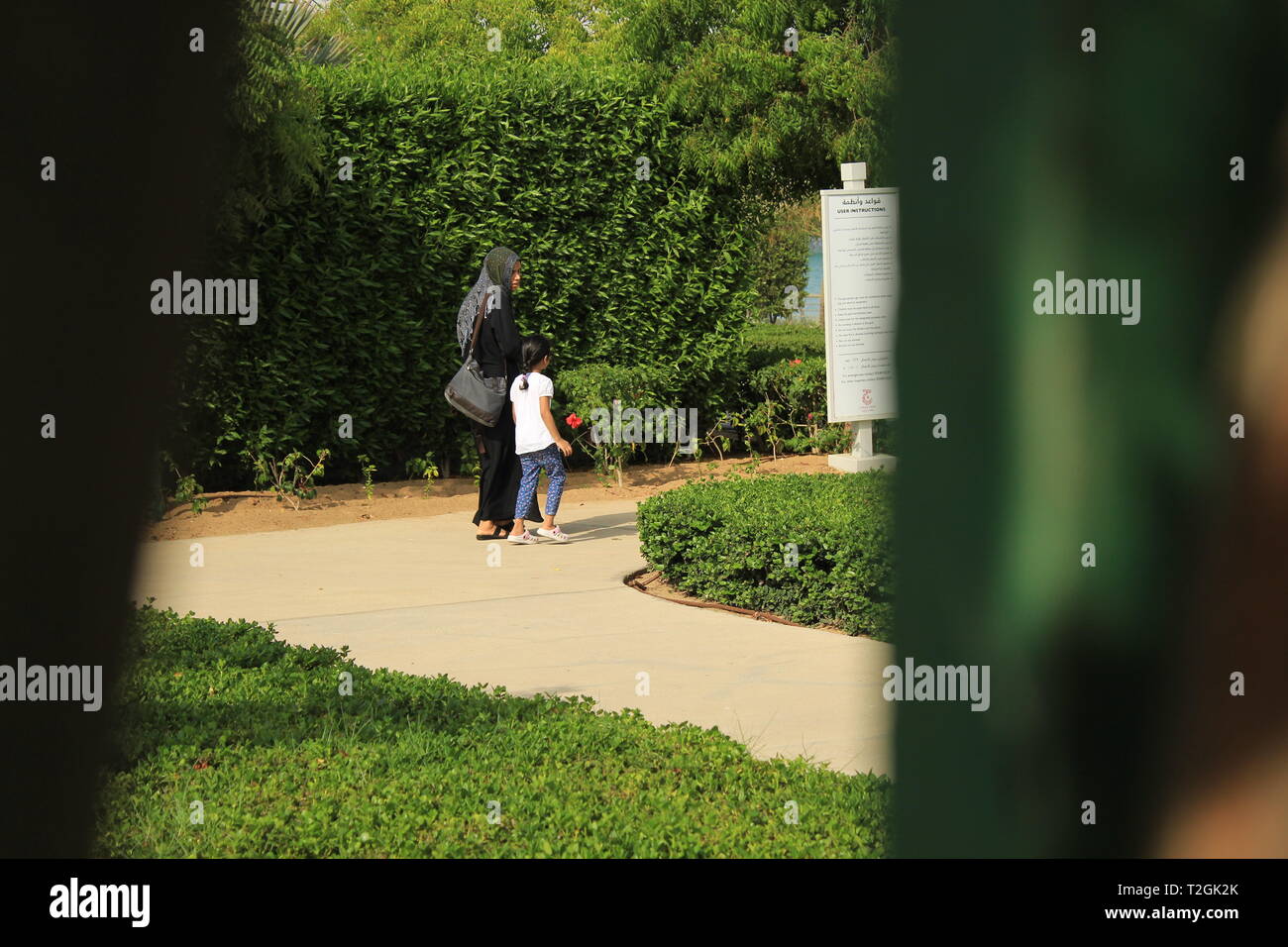 Mother and Daughter walking happy and Peaceful along a path surrounded ...