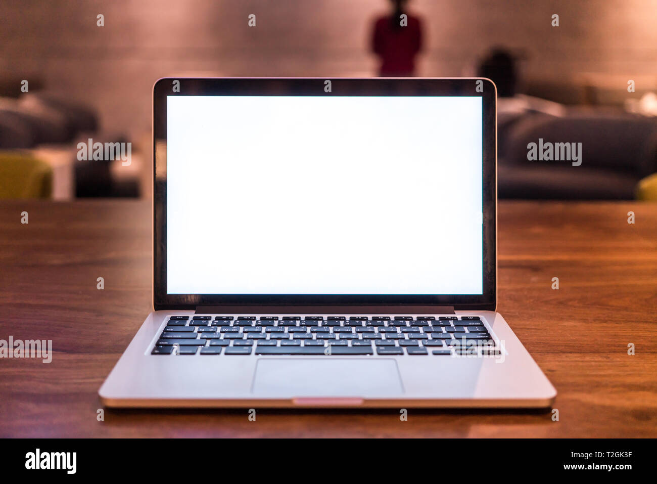 Conceptual workspace, Laptop computer with blank white screen on table ...