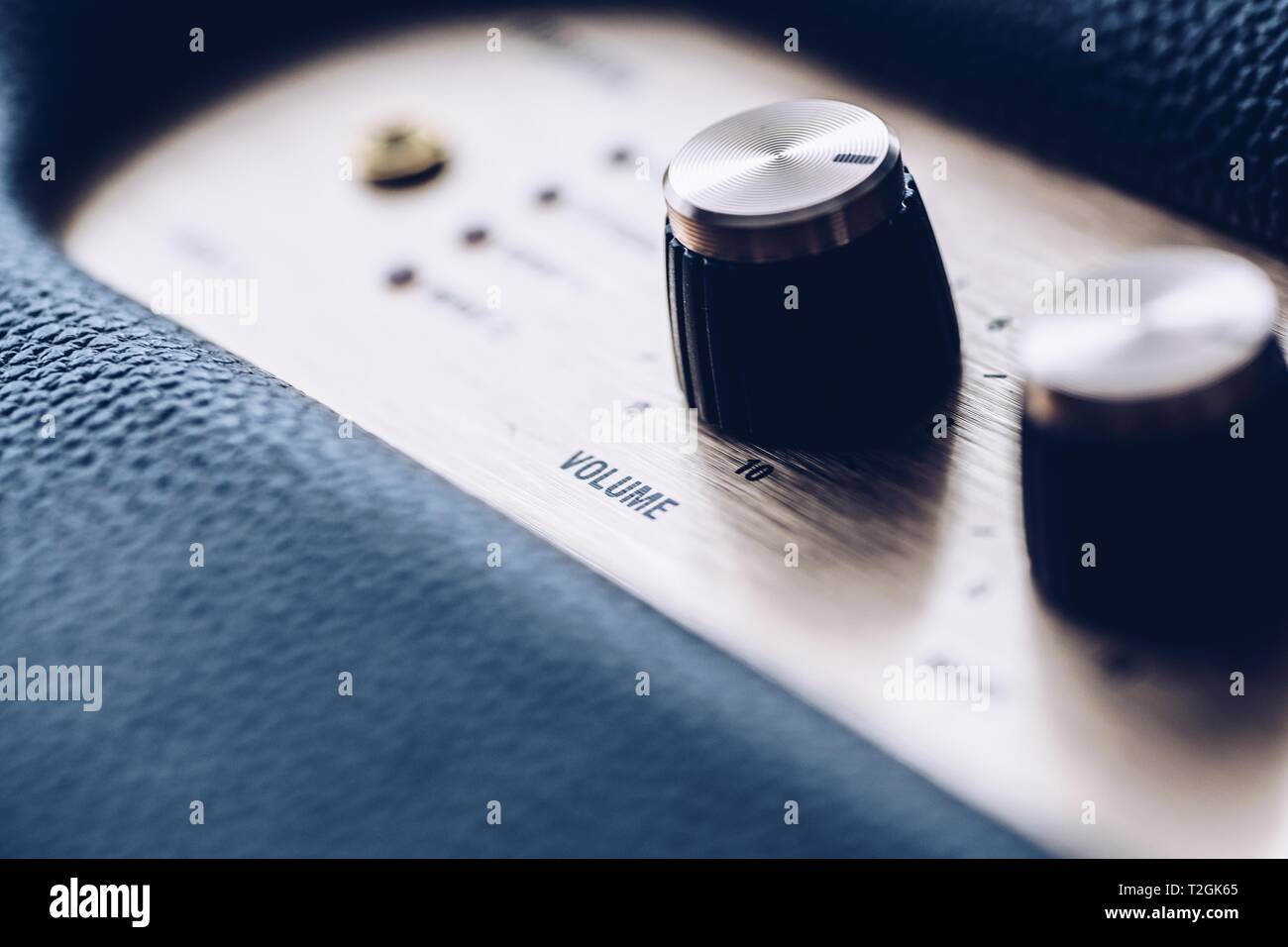 Music volume control knob on music amplifier Stock Photo - Alamy