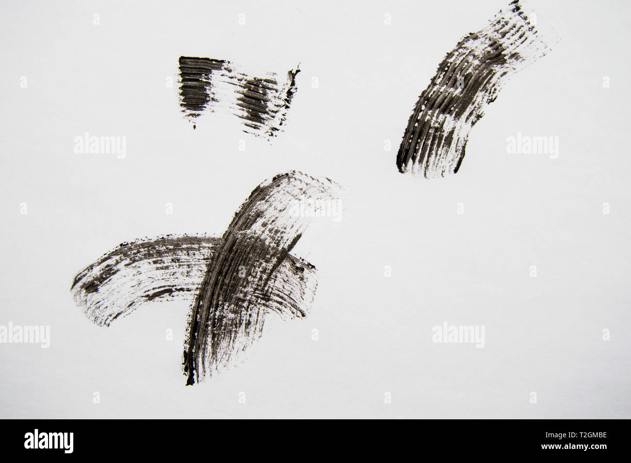 Smear of black mascara for eyelashes on white background.Texture of ...