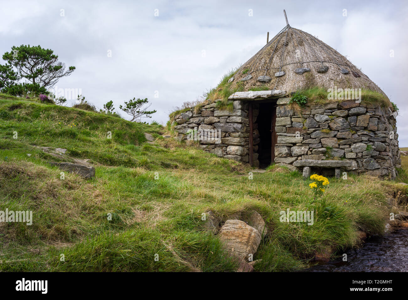 An ancient dwelling with a thatched roof on the Isle of Lewis, Outer ...