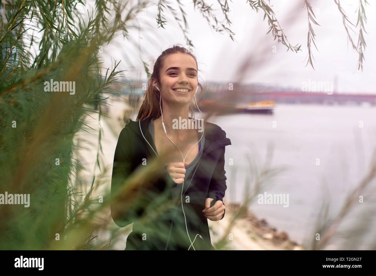 Fit female running along park hi-res stock photography and images - Alamy