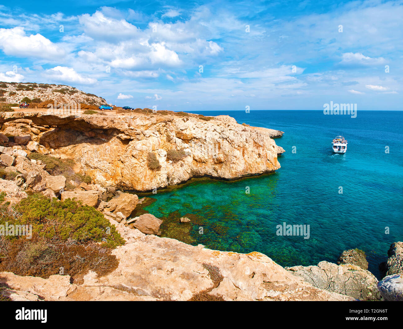 View of a bay near Cape Greco, Cyprus. Rock coastline near deep green ...