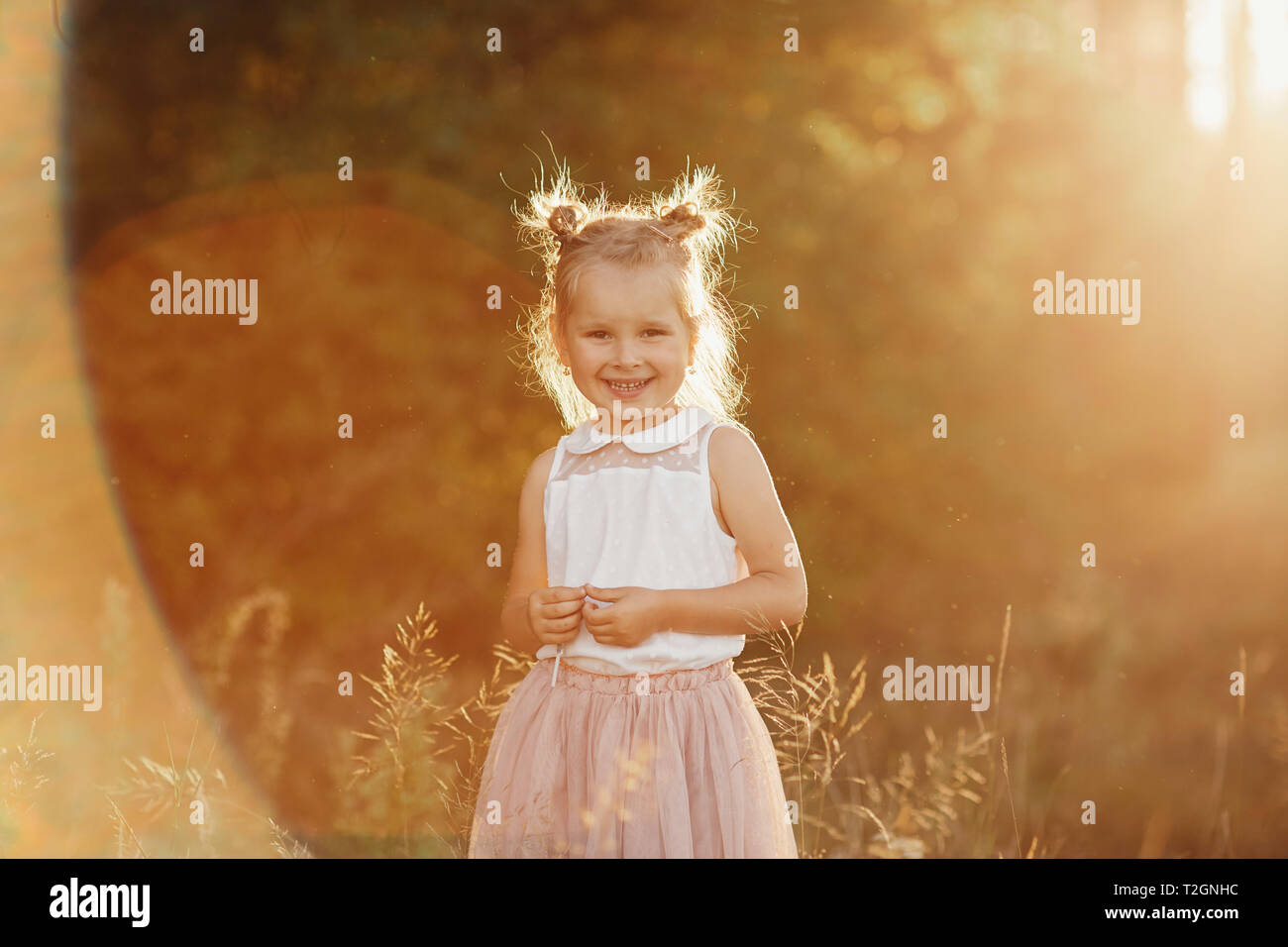 beautiful girl at sunset. children's portrait of a girl Stock Photo - Alamy