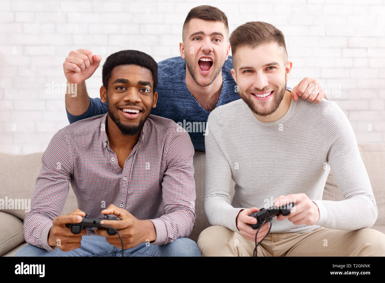 Men playing football laughing hi-res stock photography and images - Alamy