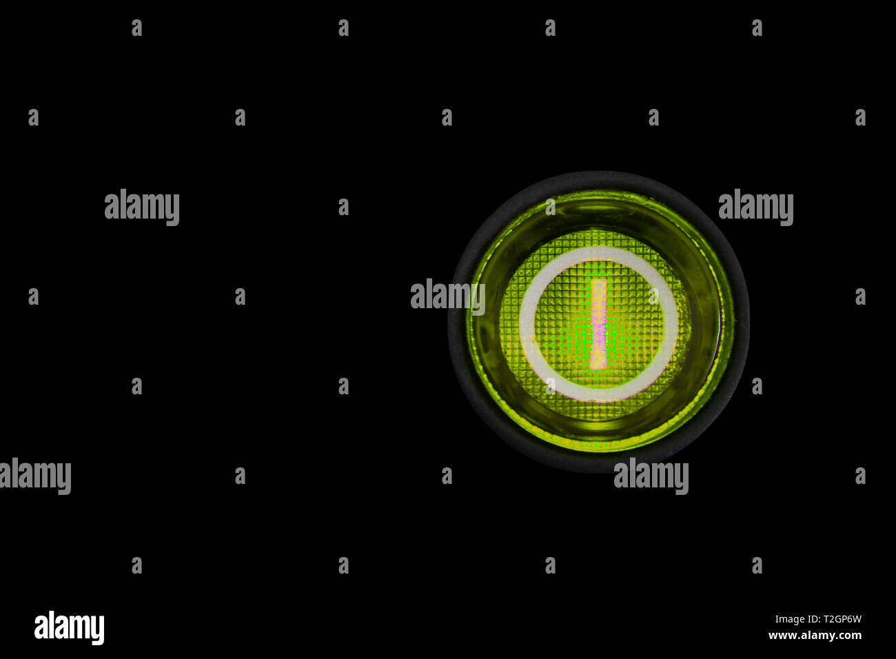 Round green power (on and off) button or switch with retro illumination ...