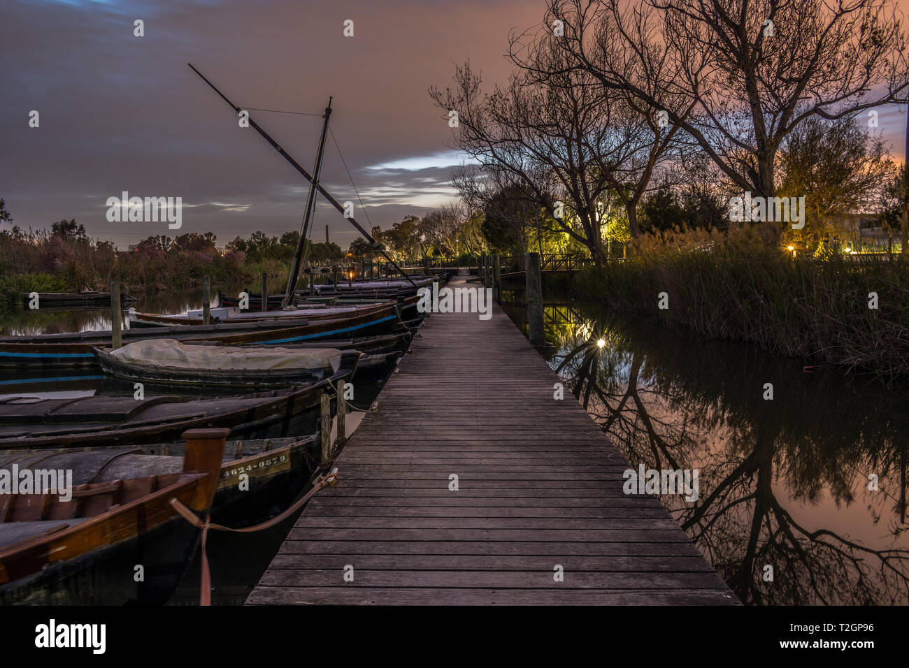 Catwalk in the harbor of fishing boats Stock Photo - Alamy