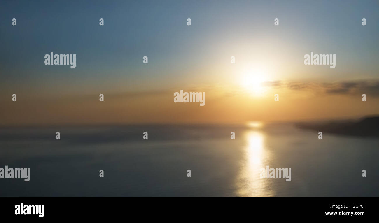 Blurred sunset at the calm sea coast, summer background Stock Photo - Alamy