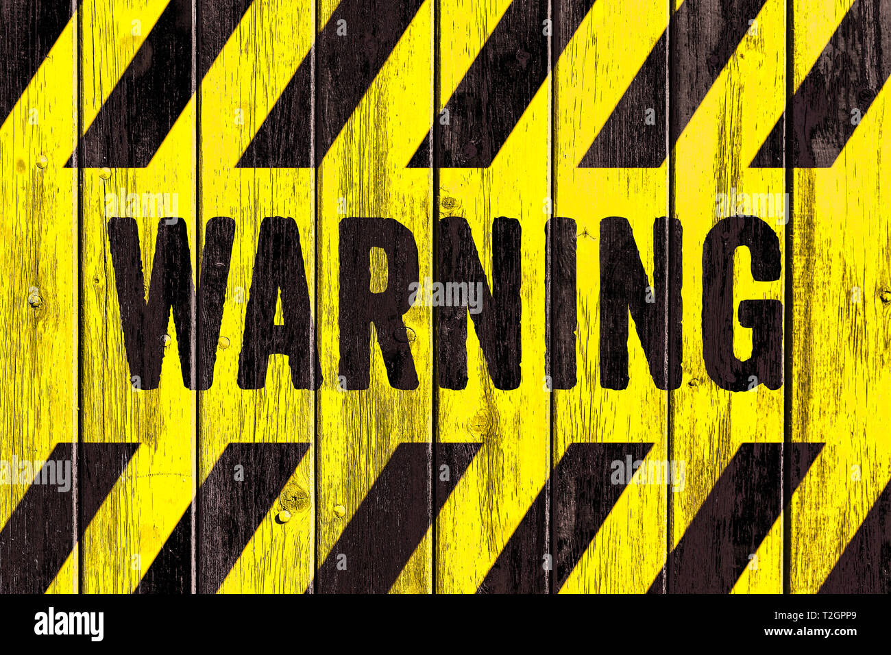 WARNING danger sign word text as stencil with yellow and black stripes ...
