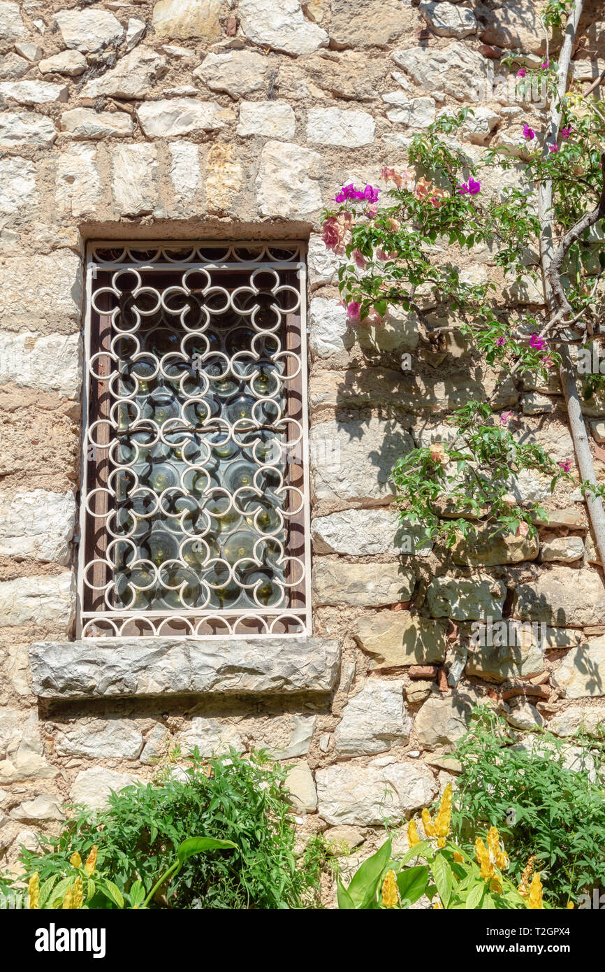 Window in a wall of a medieval house in the French village of Eze Stock ...