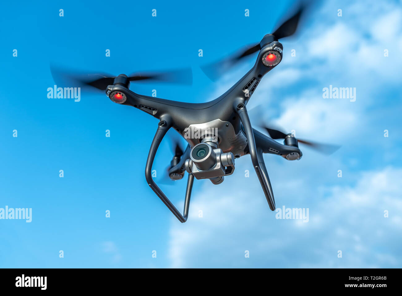 Modern beautiful dark drone in the sky Stock Photo - Alamy