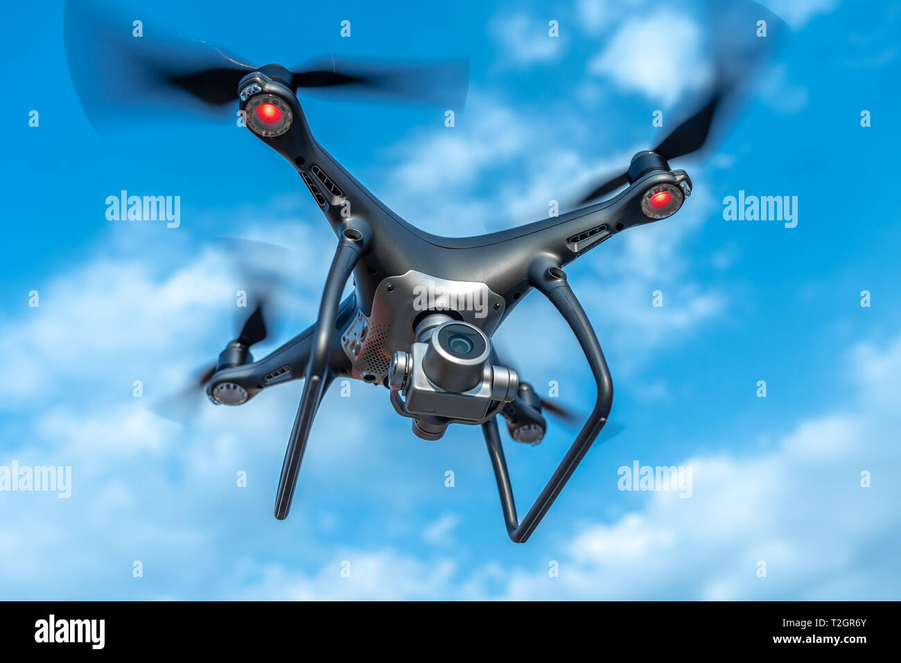 Modern beautiful dark drone in the sky Stock Photo - Alamy