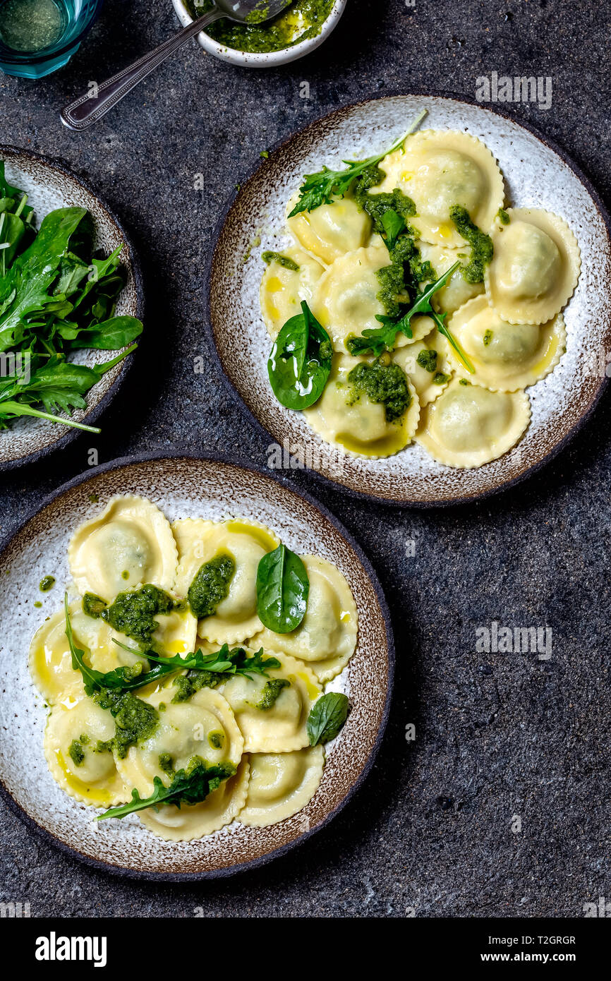 Italian spinach ricotta ravioli, Top view, black background, copy space ...