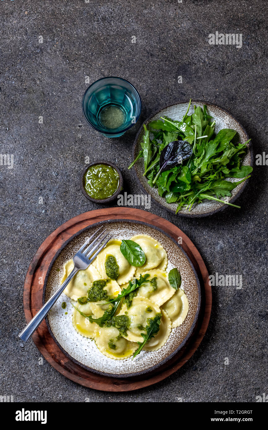 Italian spinach ricotta ravioli, Top view, black background, copy space ...
