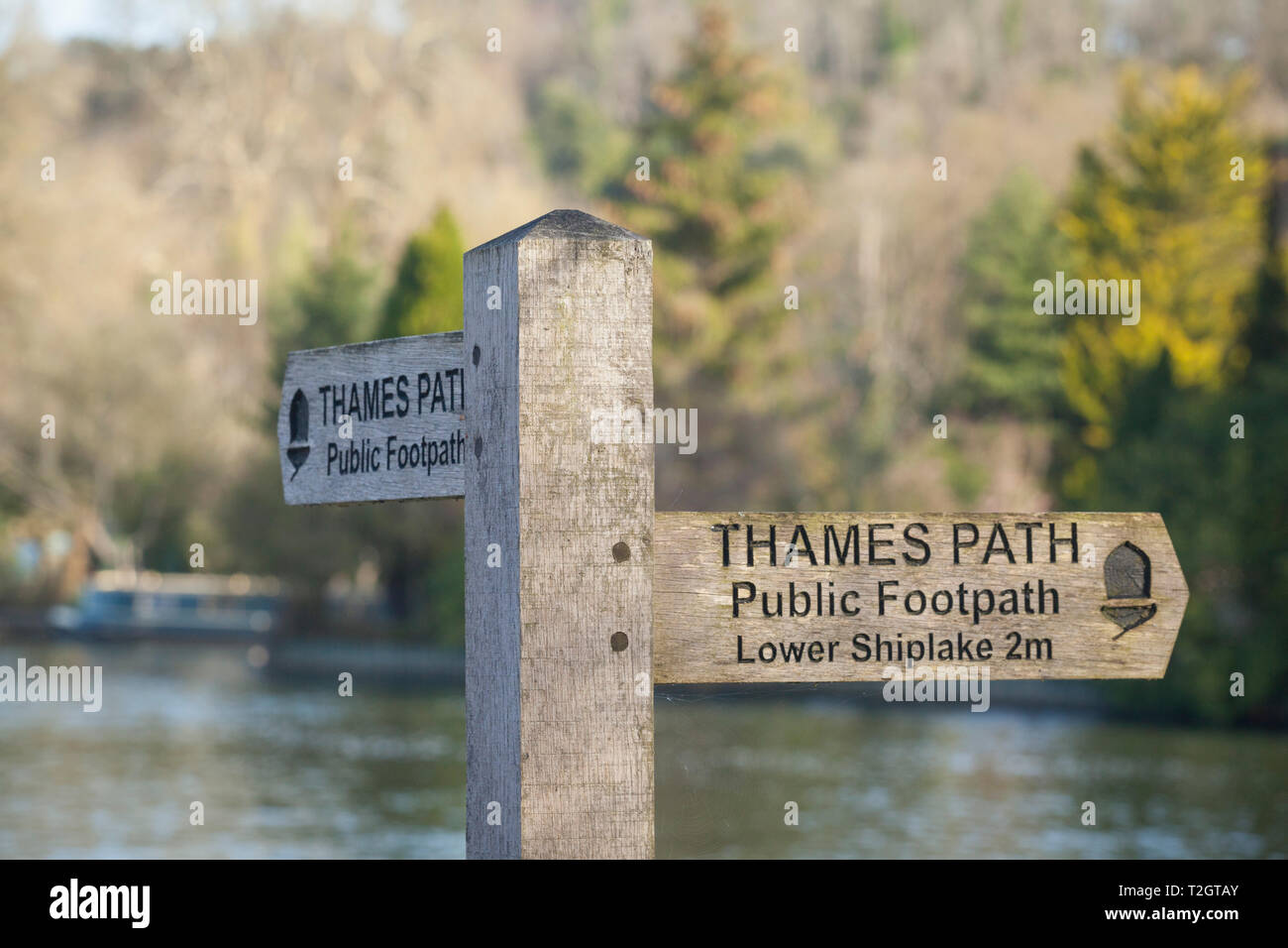 An oak signpost for the Thames Path at Marsh Lock near Henley-on-Thames ...