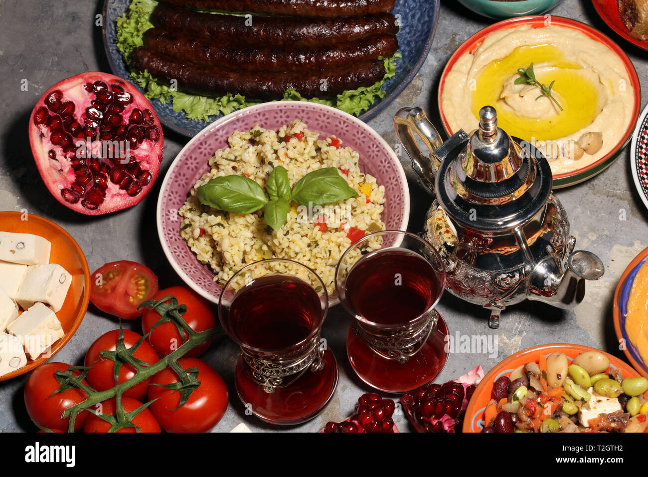 Middle eastern or arabic dishes and assorted meze, concrete rustic ...