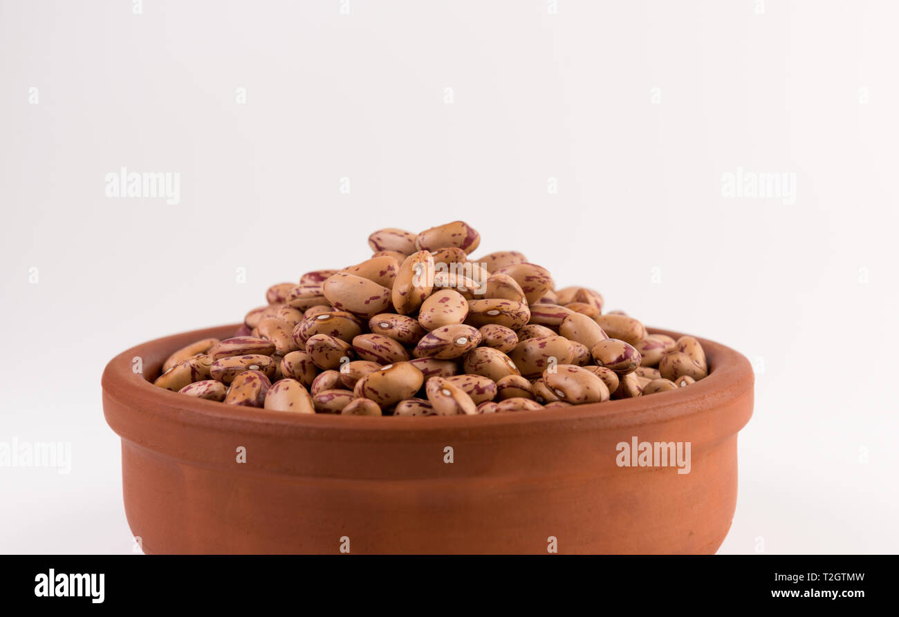 A plate of beans on white background Stock Photo - Alamy