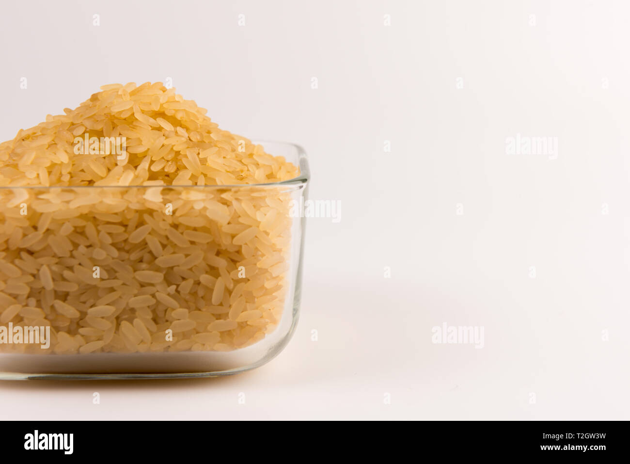 white rice in bowl isolated on white background Stock Photo - Alamy