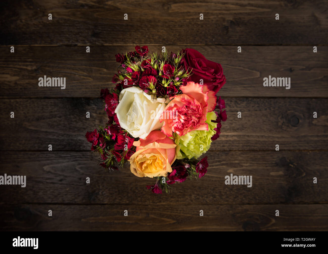 Bouquet of flowers on a wooden table background. Vintage floral ...
