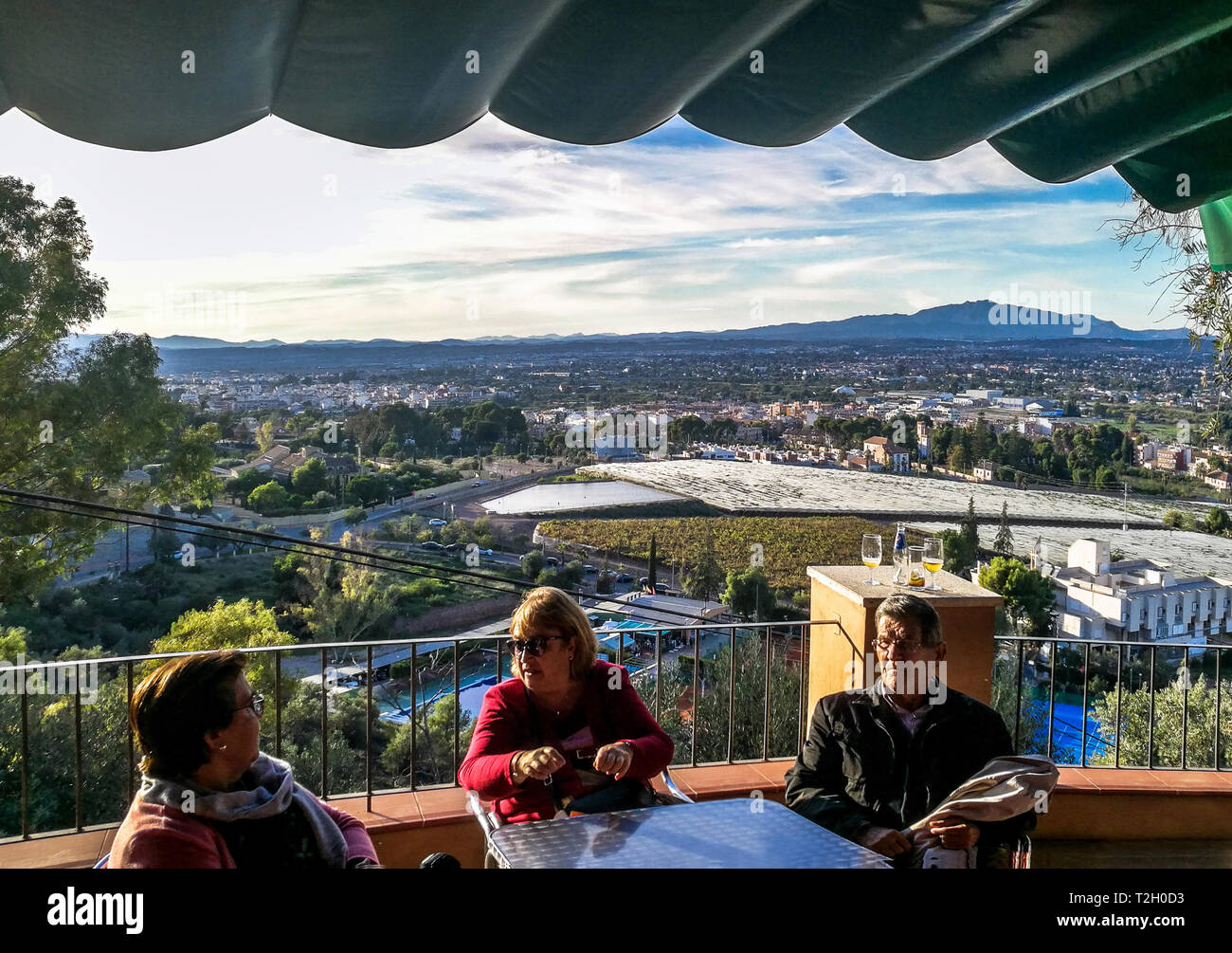 Minimalist rear view of friends looking talking and looking at the ...