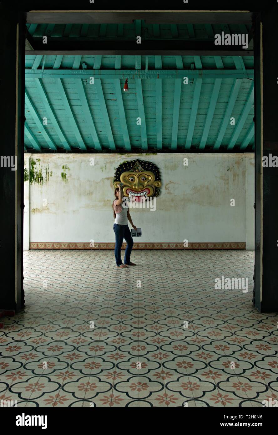 A female tourist takes a picture of traditional decoration inside ...
