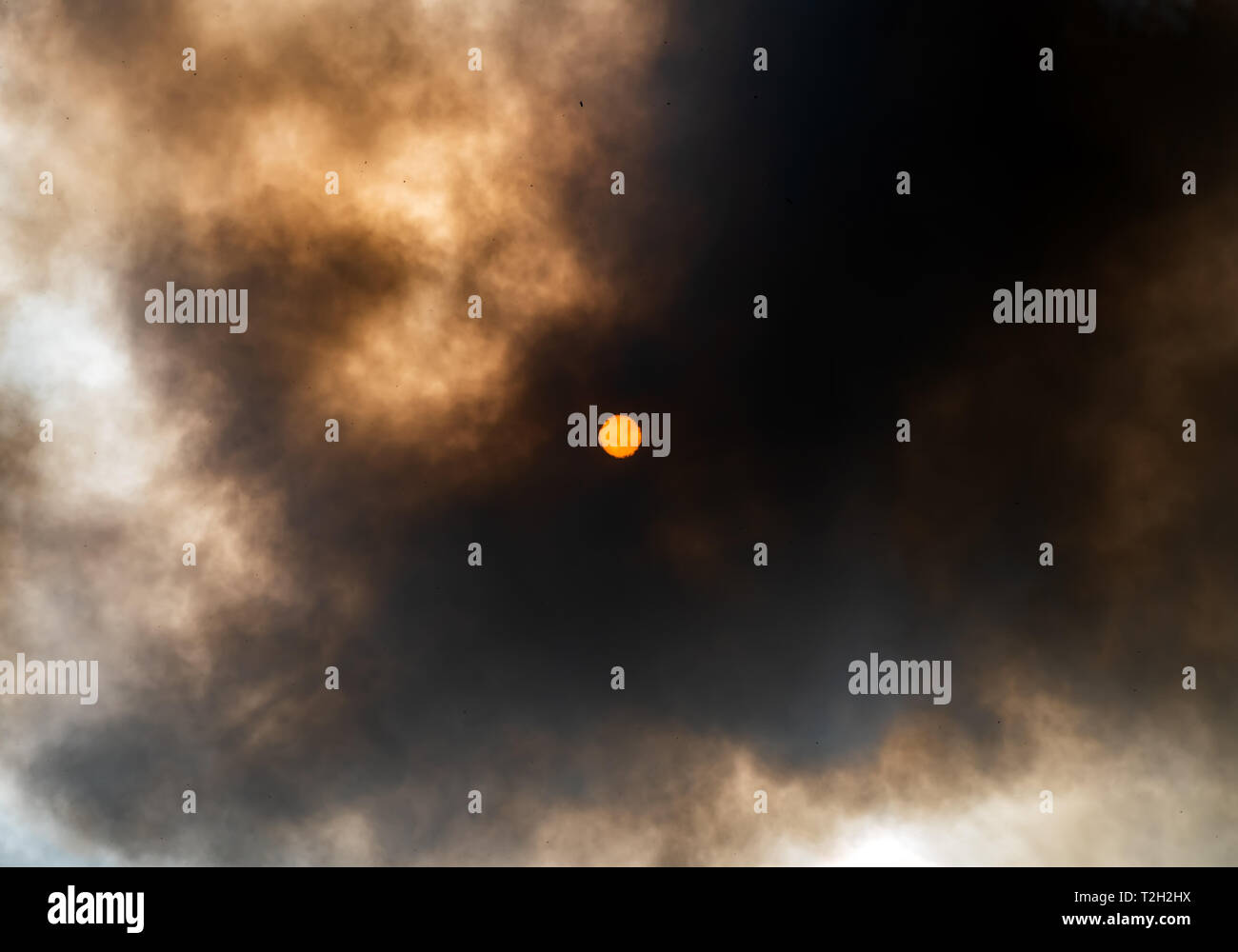 Thick black acrid smoke on the sky background Stock Photo - Alamy